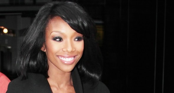 Brandy Norwood's Stylish Return to BBC Studios: Orange Celine Bag and ...