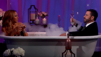 Mariah Carey Gets Shoes Wet During Bubble Bath Interview