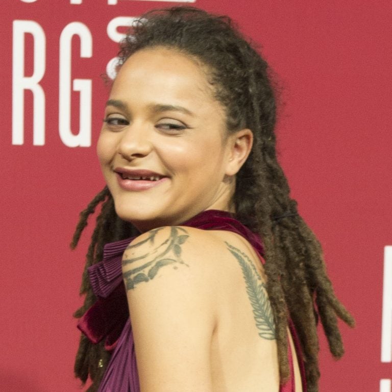Sasha Lane Flashes Smiley Teeth Despite Challenging Childhood