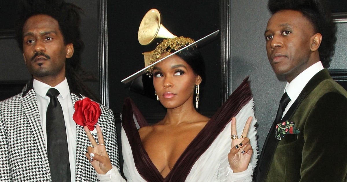 Janelle Monáe's Square Hat With Gold Crown and Interlocking Safety Pins