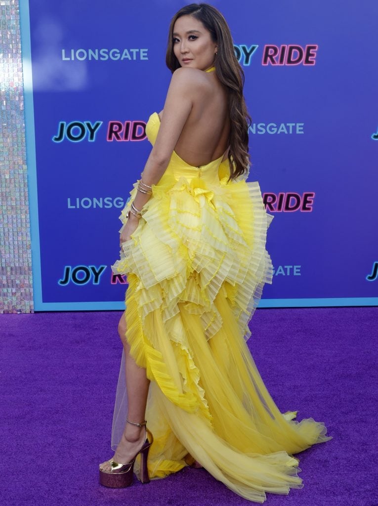 Ashley Park's Yellow Versace Dress at Joy Ride's LA Premiere Steals the ...